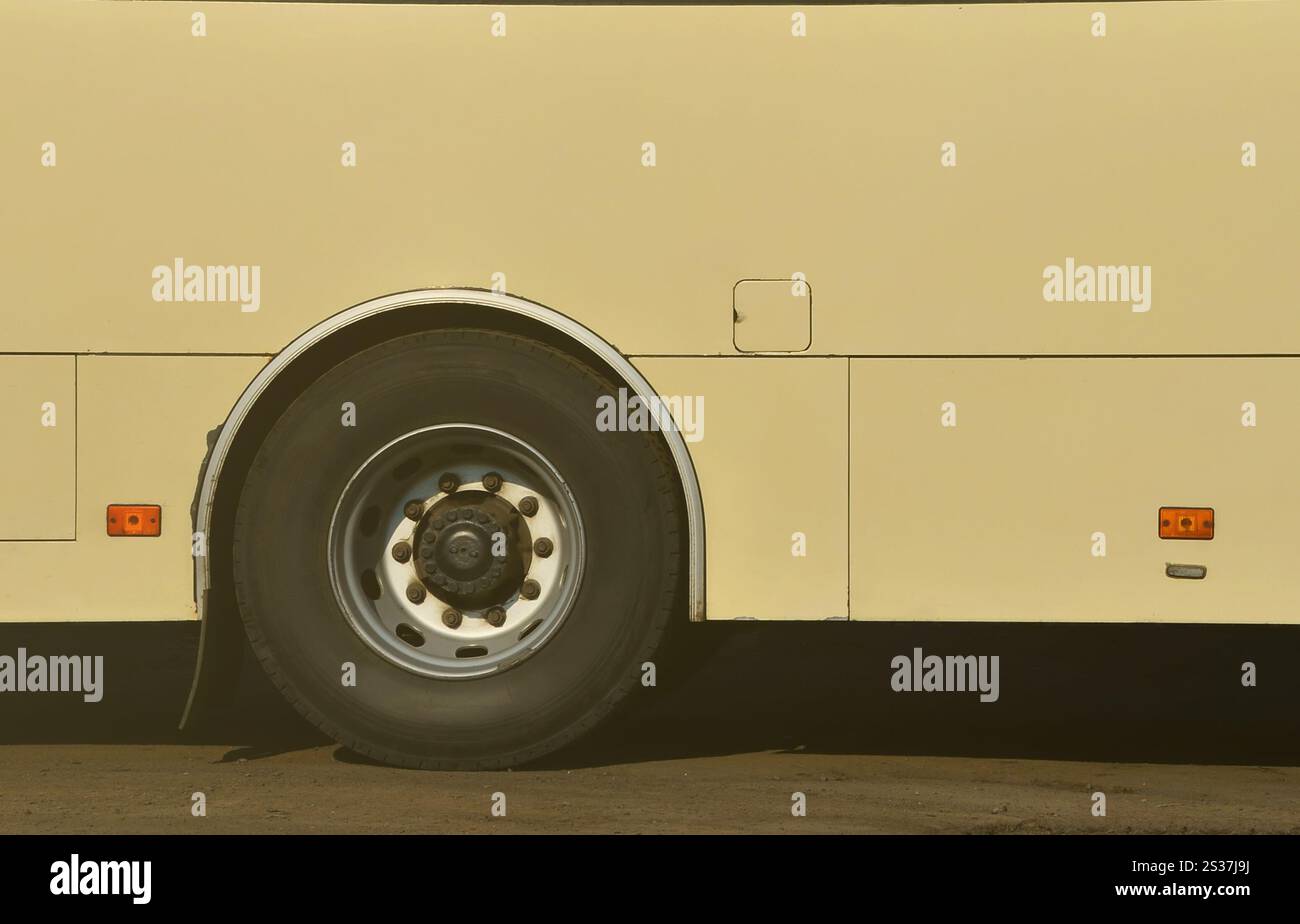 Photo of the hull of a large and long yellow bus with free space for ...