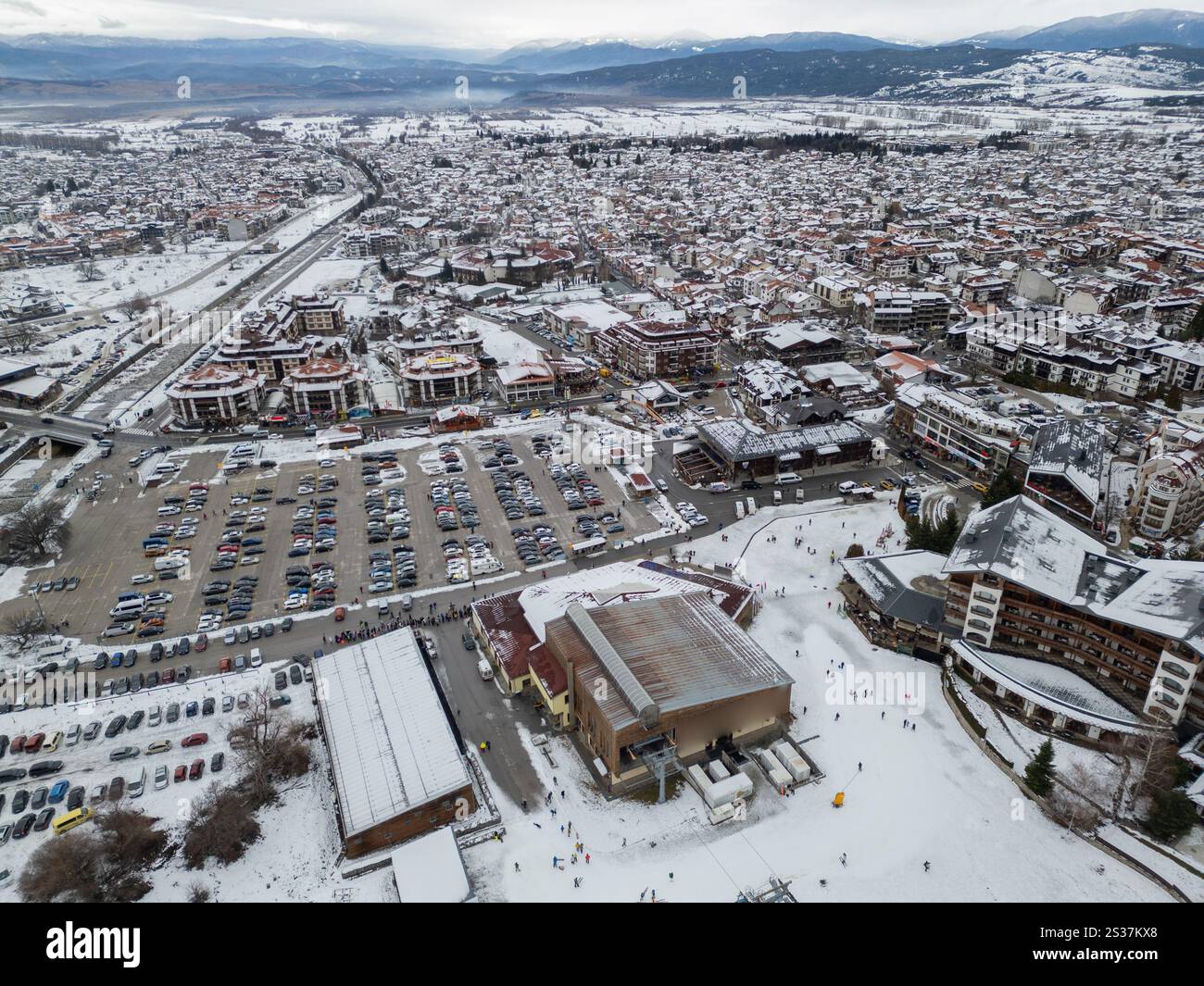 Winter landscape of a busy resort town Bansko with snow-covered ...