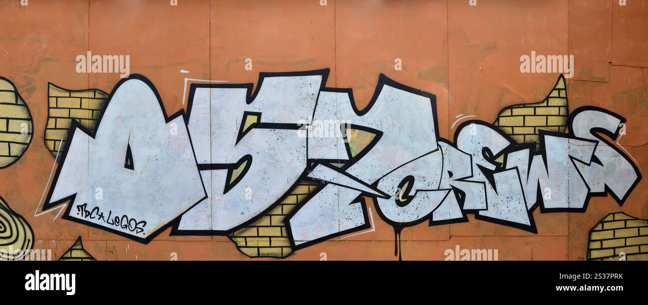 A photograph of a detailed wall artwork. Graffiti drawing is made with ...