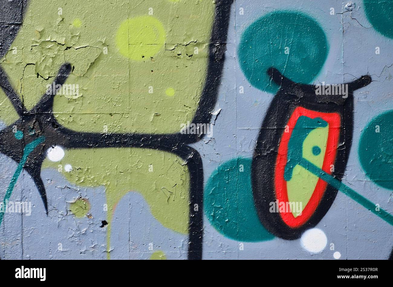 Fragment of an old colored graffiti drawing on the wall. Background ...