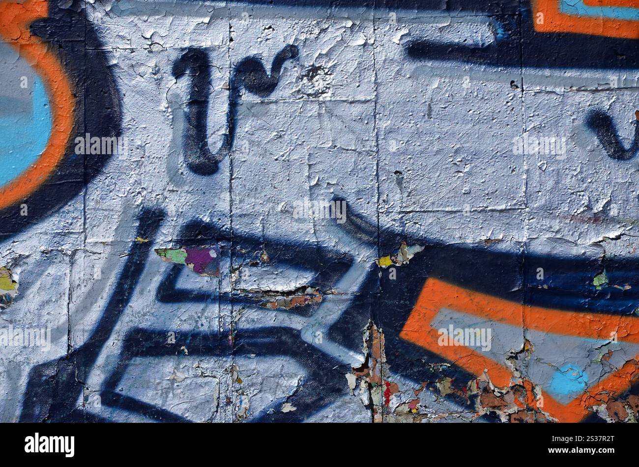 Fragment of an old colored graffiti drawing on the wall. Background ...