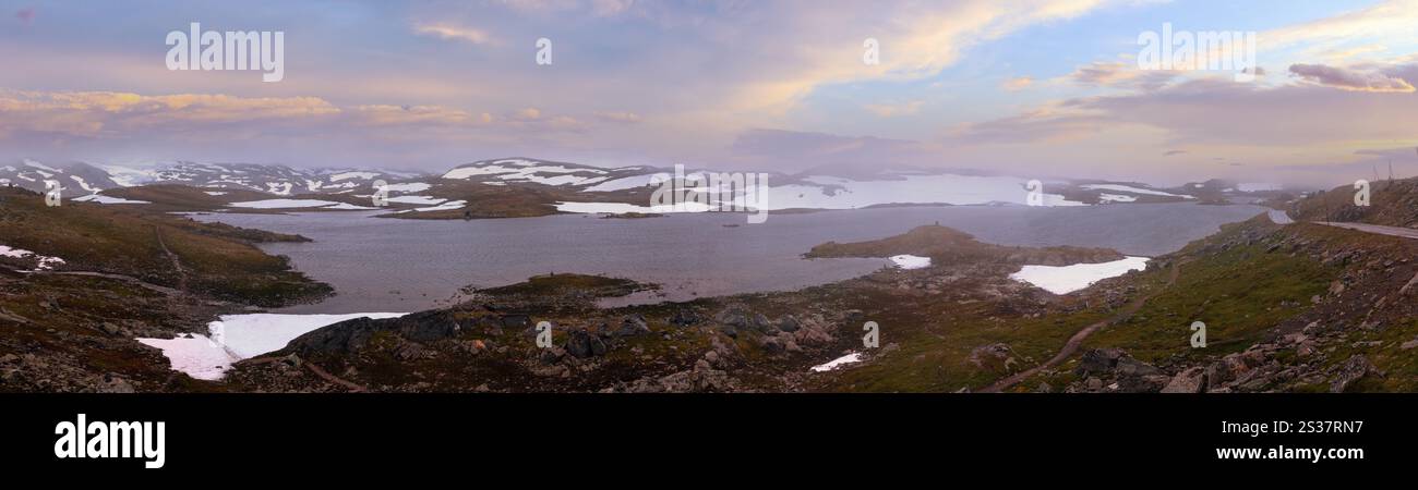 Dense fog and summer mountain landscape with lake and snow (Norway, not ...