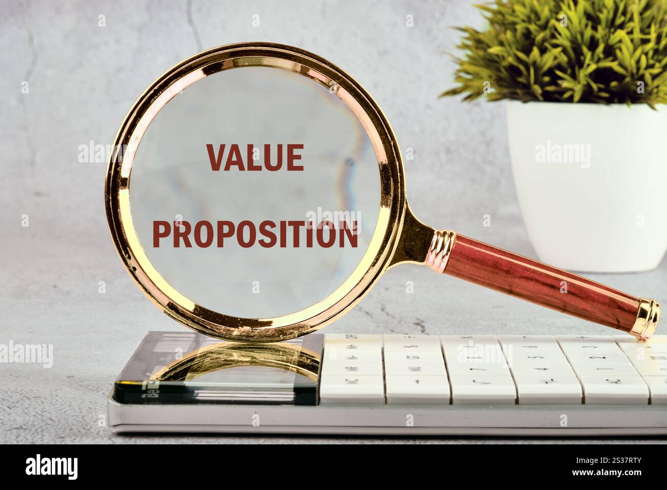 Value added concept. Words VALUE PROPOSITION on a gray background standing on a calculator Stock ...
