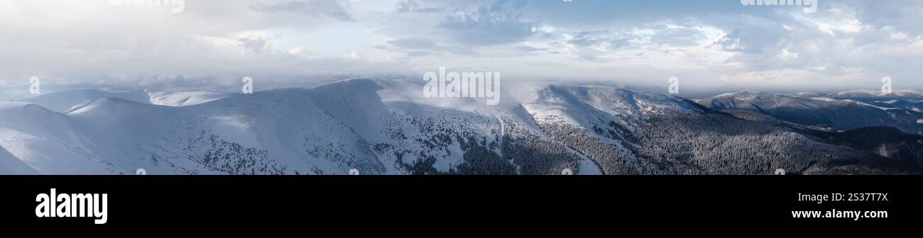 Snow and wind formed ice formations covered winter mountain plateau hi ...