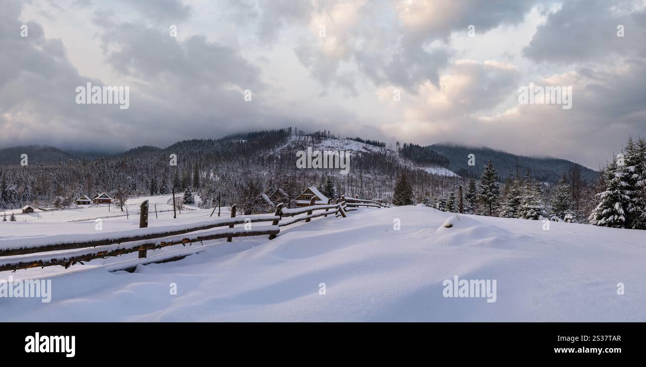 Countryside hills, groves and farmlands in winter remote alpine ...