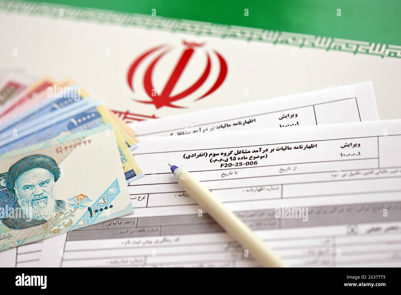 Iranian annual income tax return form F20-25-006 ready to fill on table ...