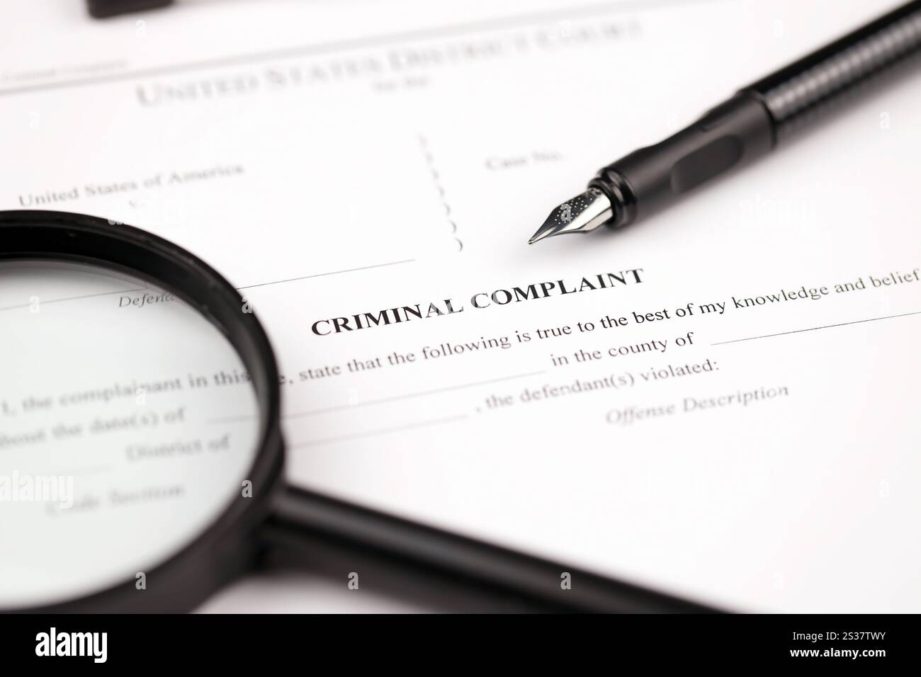 District Court Criminal complaint court papers on A4 tablet lies on ...