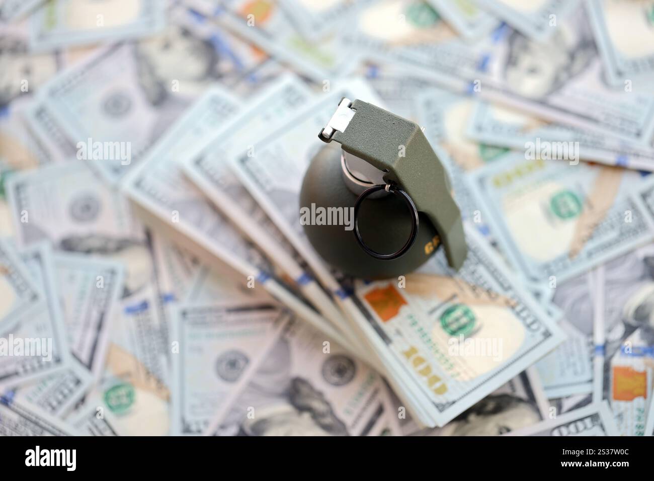 Grenade with a check against the background of huge amount of american ...
