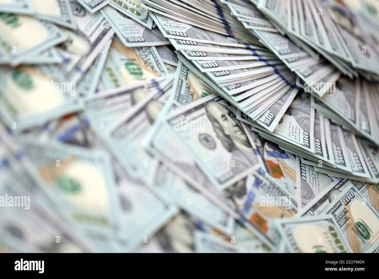 Very big amount of US hundred dollar bills close up. Huge quantity of ...