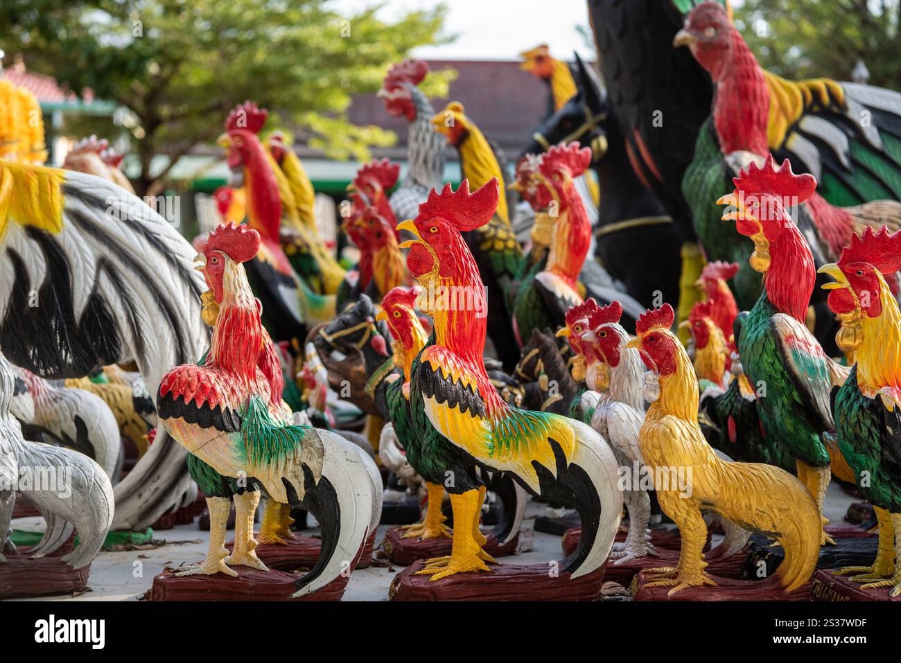 Chicken and Rooster Figures atay in front of the Monument and Statue of ...