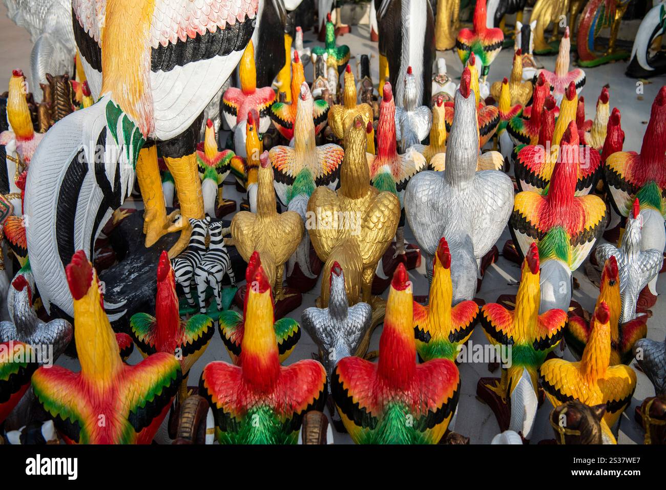 Chicken and Rooster Figures atay in front of the Monument and Statue of ...