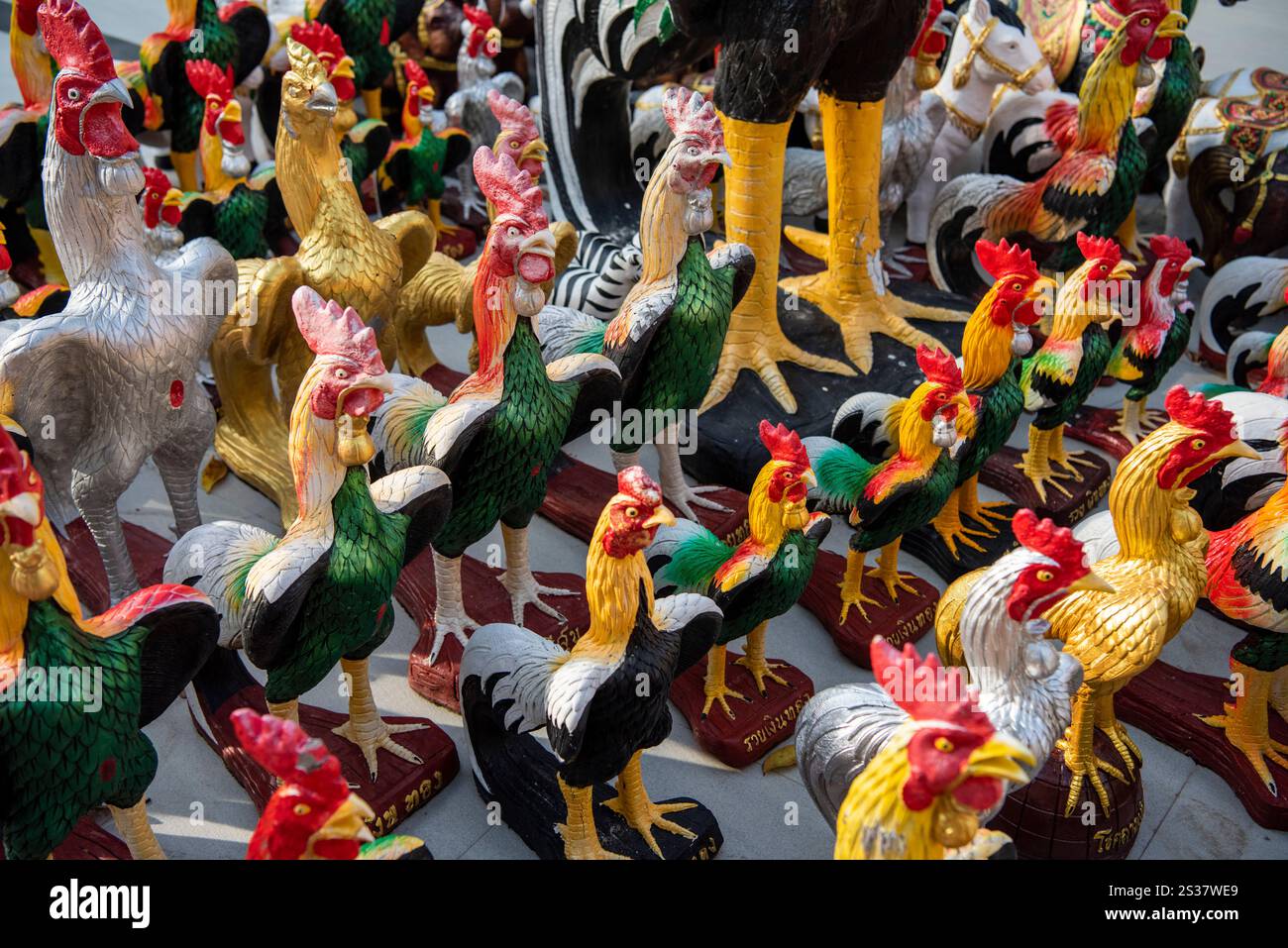 Chicken and Rooster Figures atay in front of the Monument and Statue of ...