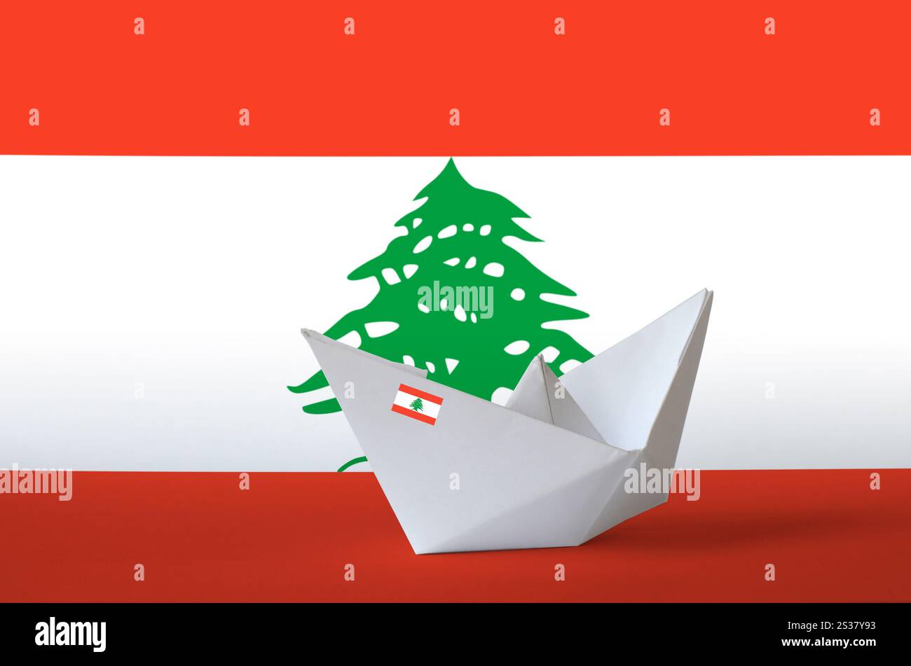 Lebanon flag depicted on paper origami ship closeup. Oriental handmade ...