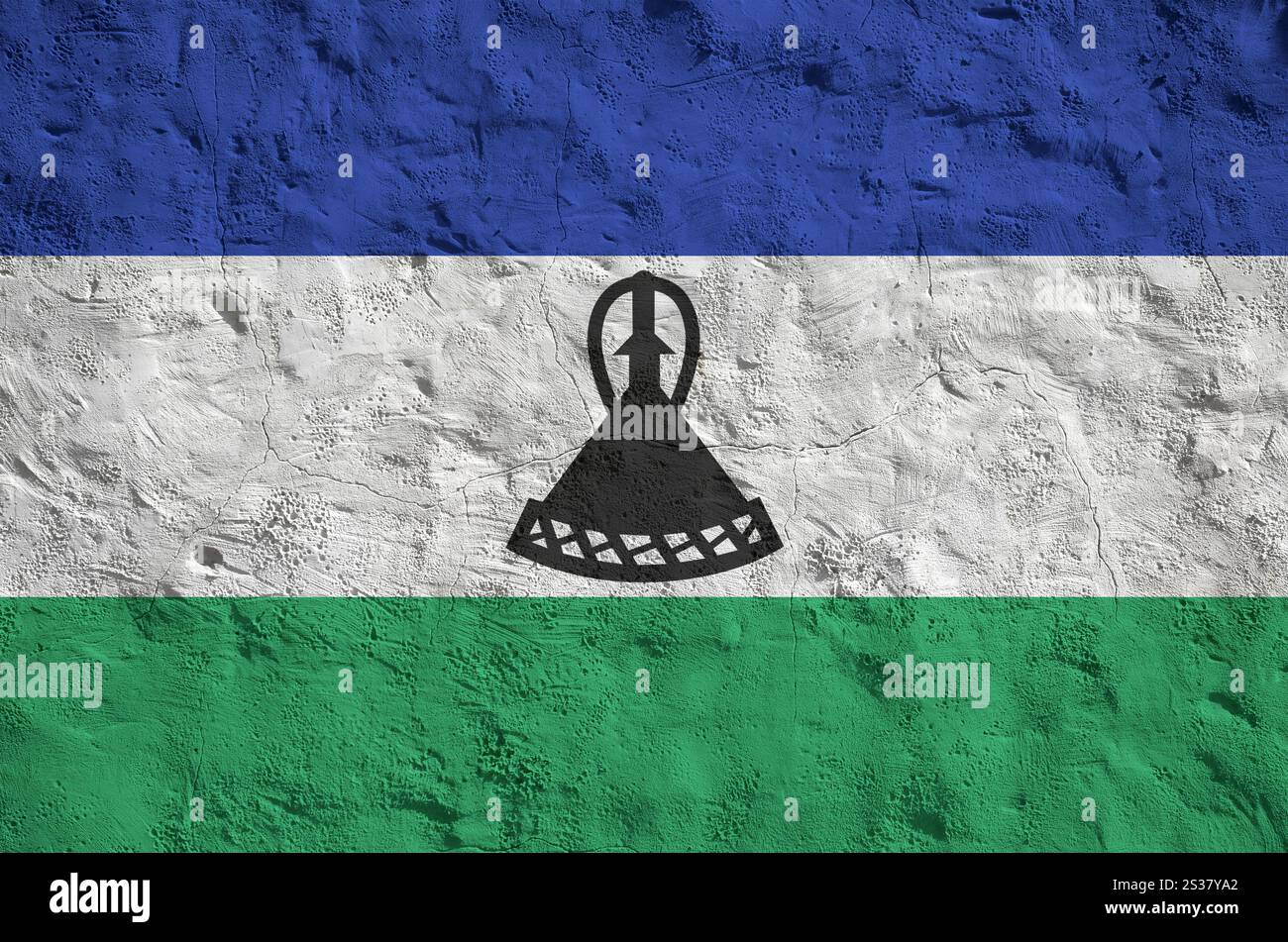 Lesotho flag depicted in bright paint colors on old relief plastering ...