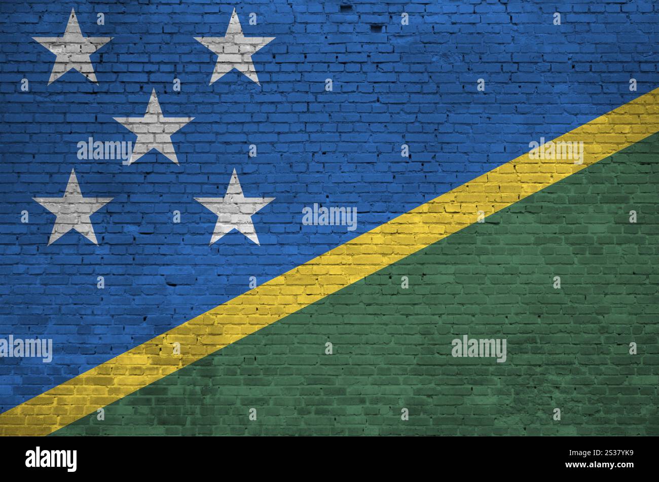 Solomon Islands flag depicted in paint colors on old brick wall close ...