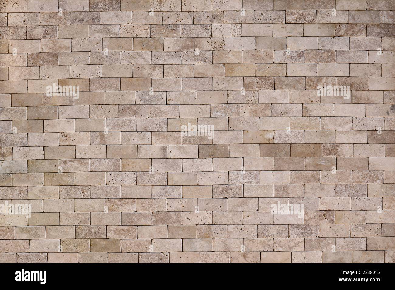 Ancient yellow brick wall background texture with old masonry close up ...