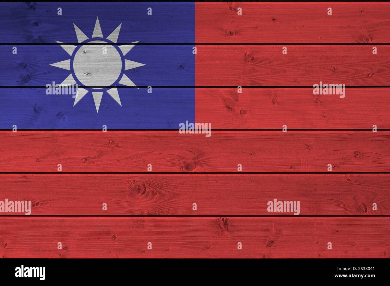 Taiwan flag depicted in bright paint colors on old wooden wall close up ...