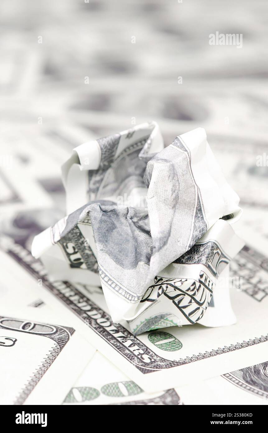Crumpled dollar bill of the United States lies on the set of smooth ...