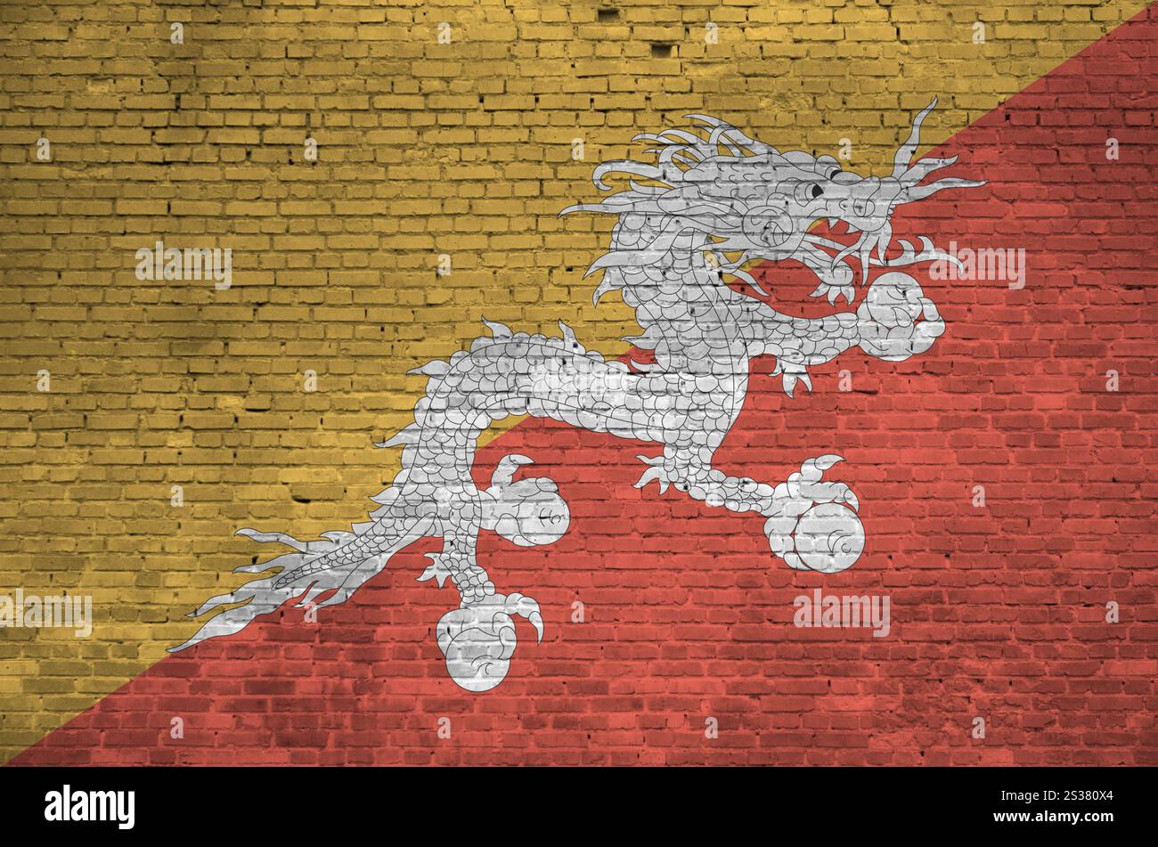 Bhutan flag depicted in paint colors on old brick wall close up ...