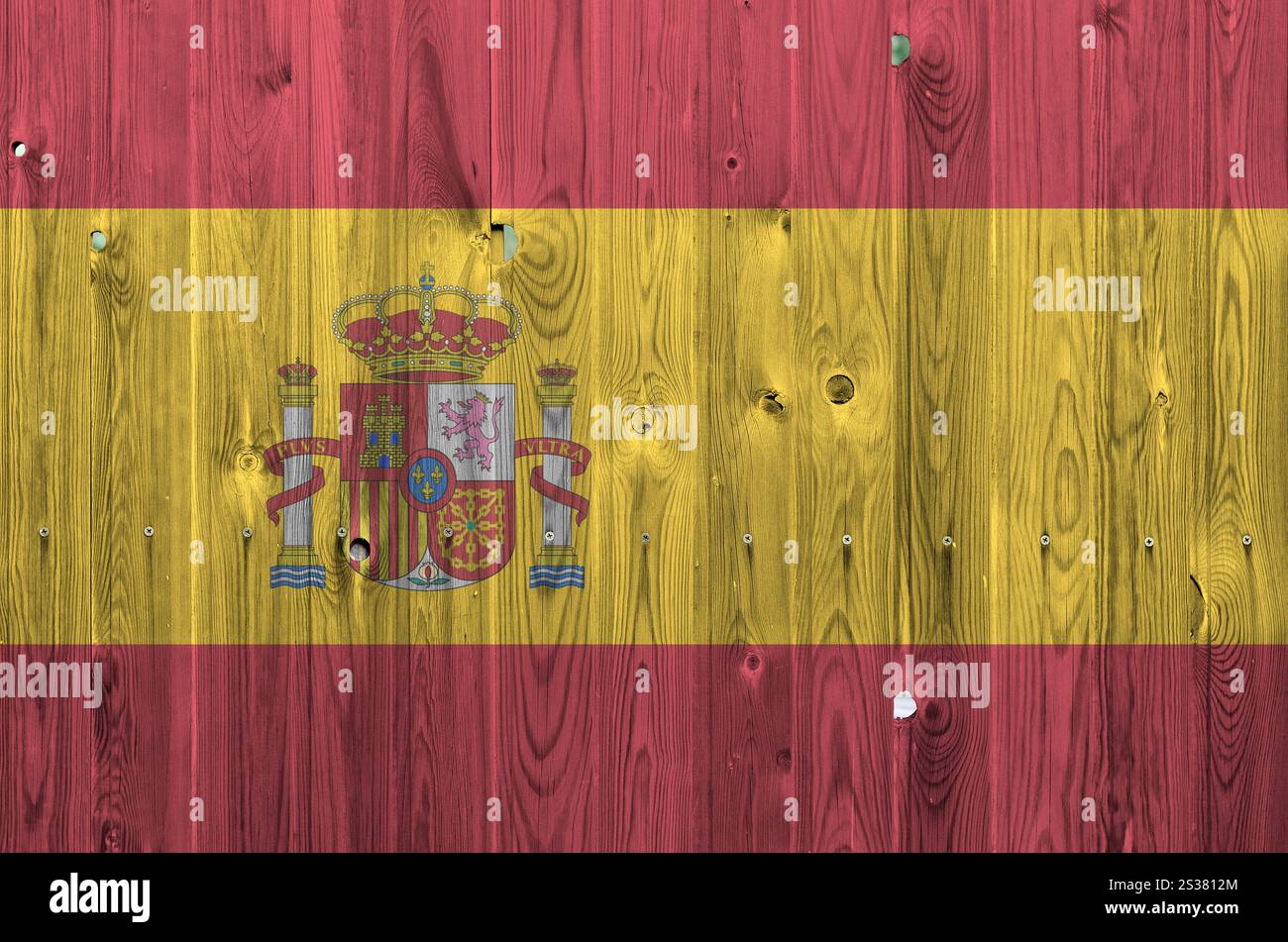 Spain flag depicted in bright paint colors on old wooden wall close up ...