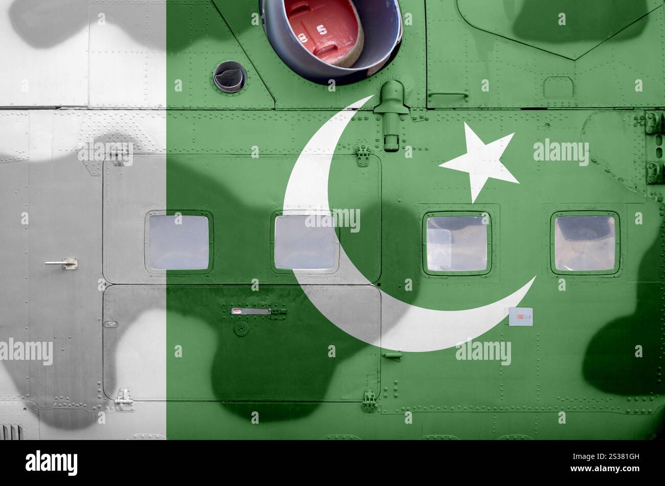 Pakistan flag depicted on side part of military armored helicopter ...