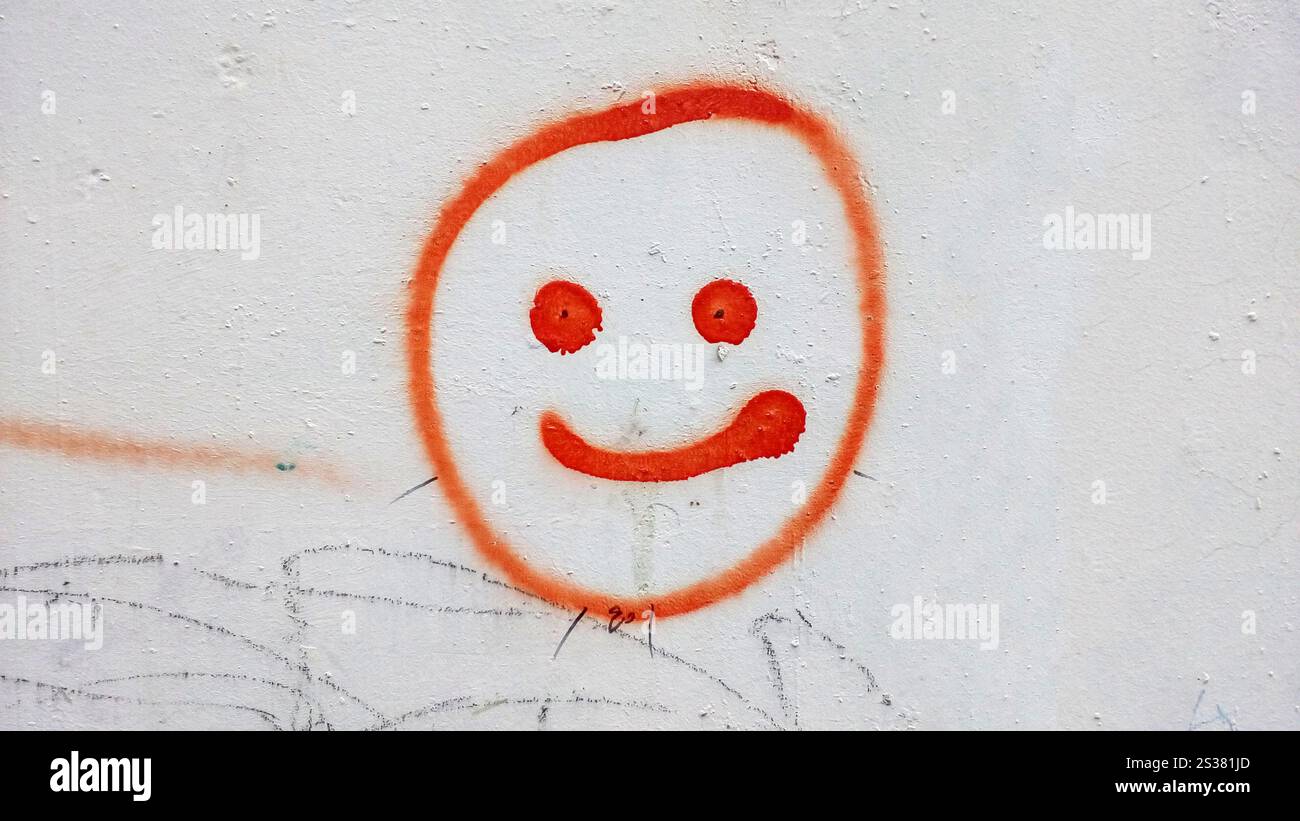 Graffiti on the ghetto wall. Smiley face on concrete background Stock ...