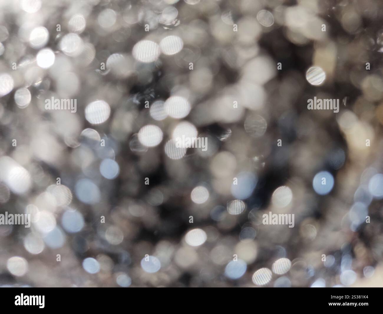 Abstract background of metallic blurred surface with bokeh spots. Art ...