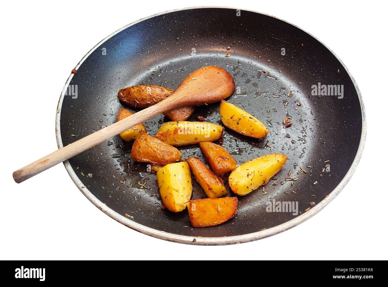 Cooking traditional village food. Fried potatoes in a frying pan and a ...