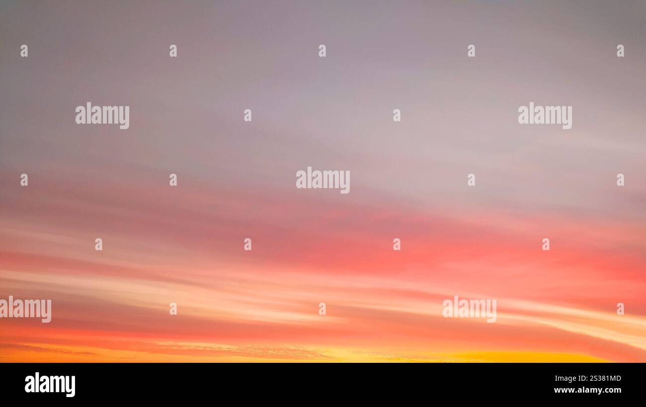 Panorama of the yellow sky with fancy clouds at sunset. Panorama of the ...