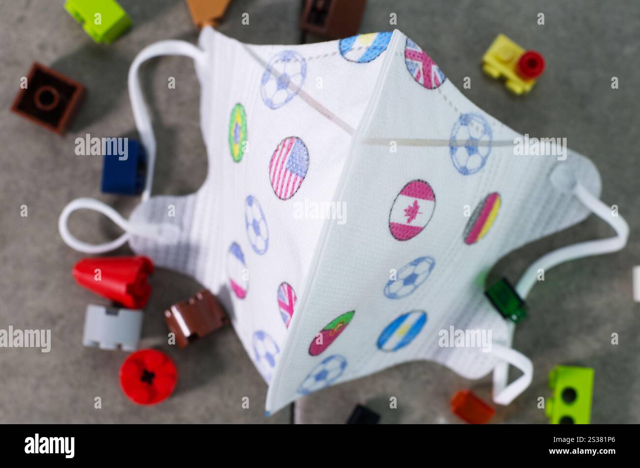 Colorful Mask Featuring Flags and Blocks on a Gray Surface Stock Photo ...