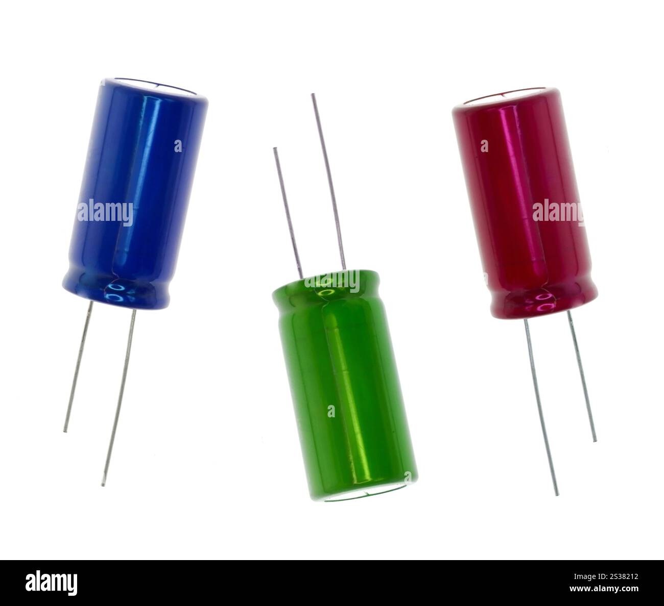 Blue, red and green electronic capacitor isolated on white background. Blue, red and green ...