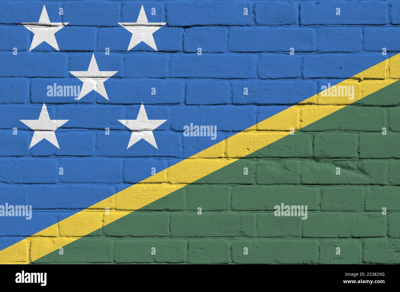 Solomon Islands flag depicted in paint colors on old brick wall close ...