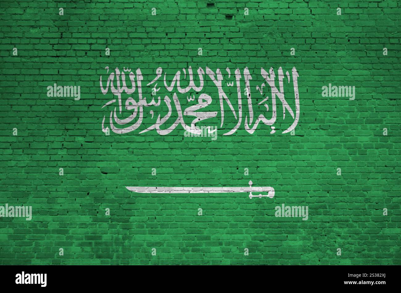 Saudi Arabia flag depicted in paint colors on old brick wall close up ...