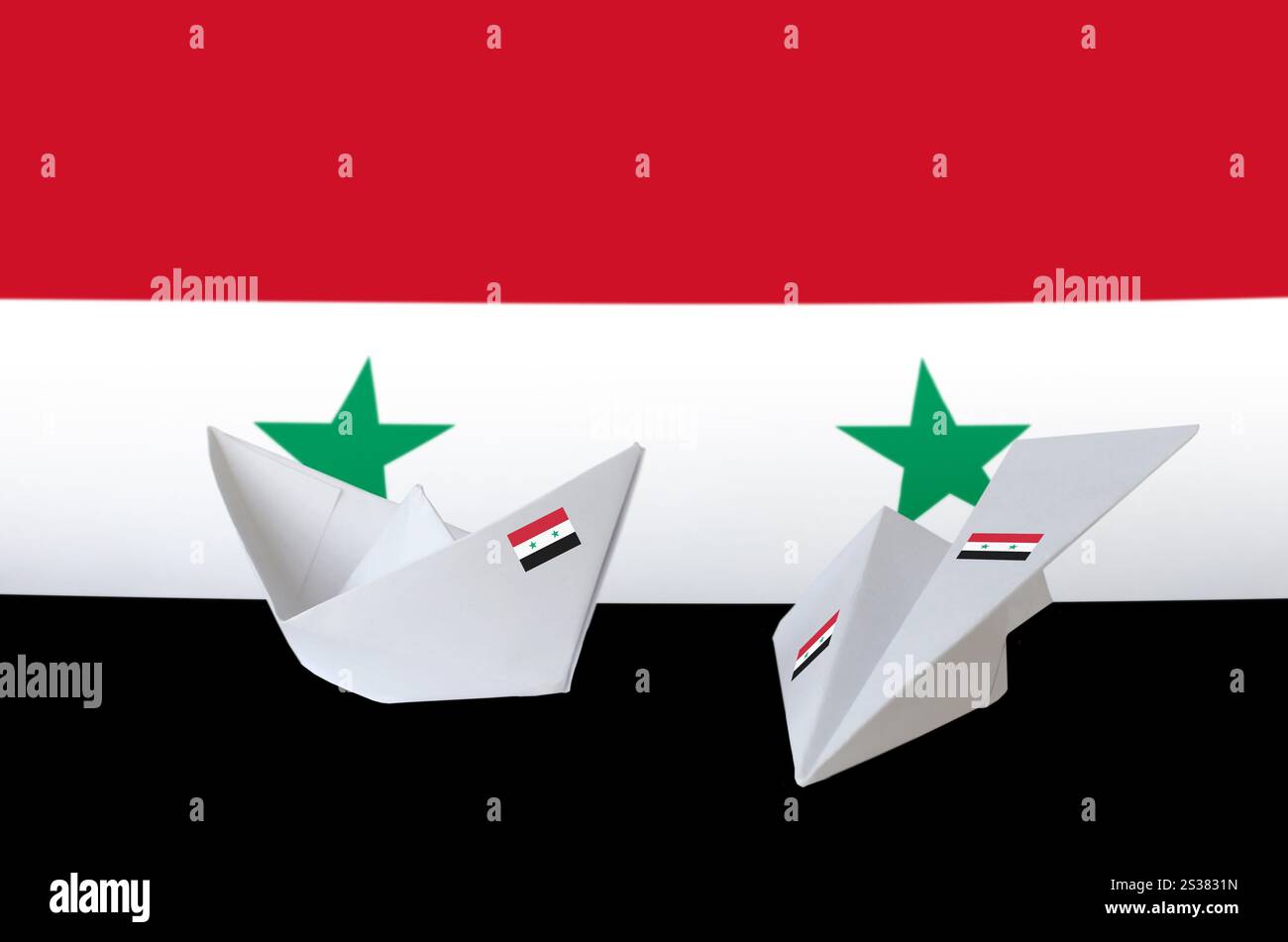 Syria flag depicted on paper origami airplane and boat. Oriental ...