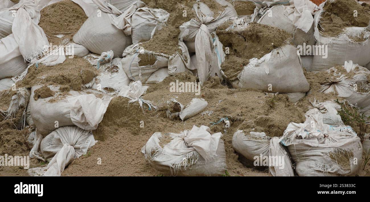 Texture of broken barricade wall made of white sandbags for war ...