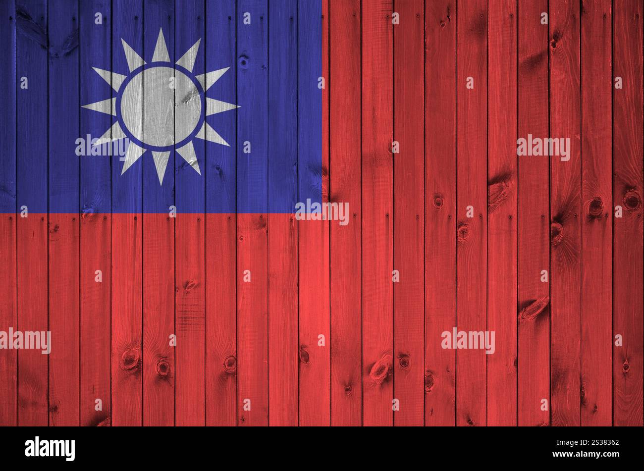 Taiwan flag depicted in bright paint colors on old wooden wall close up ...