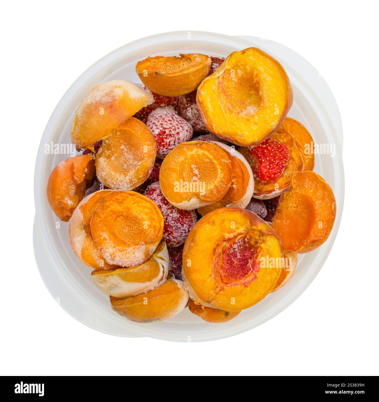 Frozen peaches apricot strawberries in a bowl isolated on white ...