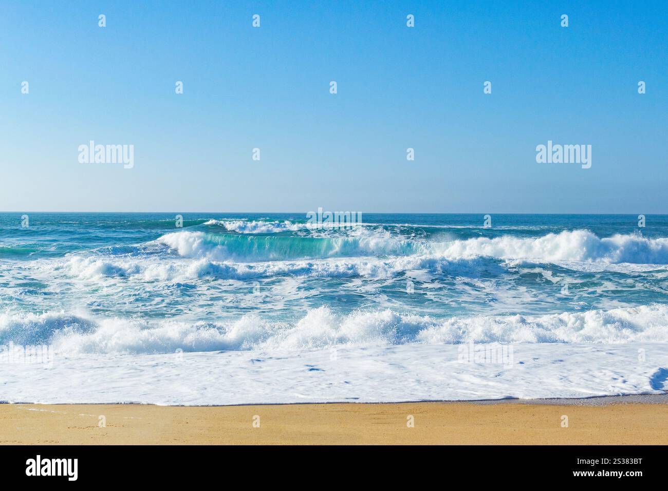 Beautiful ocean waves on a golden sand beach. Alone with nature ...