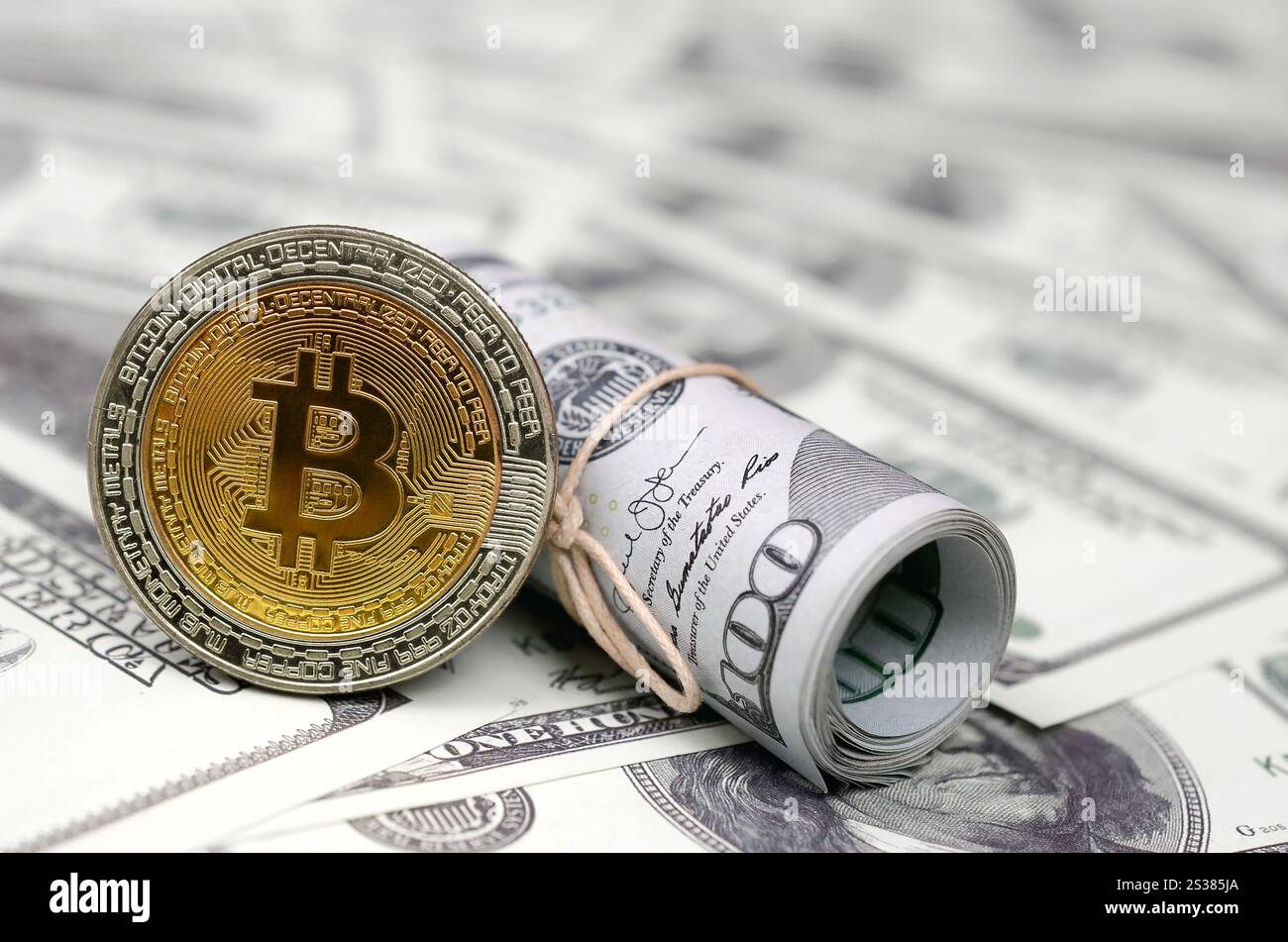 Bitcoin coin and banknotes of one hundred dollar. Conceptual image for ...