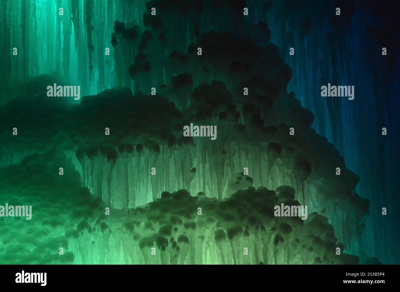 Huge ice icicles. Fragment of large blocks of ice frozen waterfall of ...