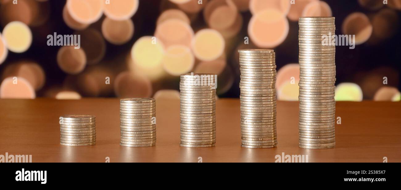 Golden coin stacks arranged as a graph. Increasing columns of coins ...
