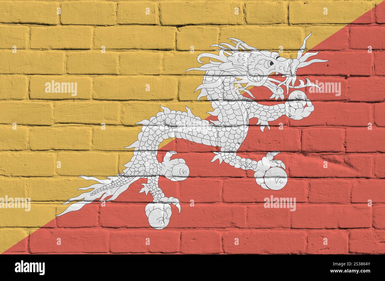 Bhutan flag depicted in paint colors on old brick wall close up ...