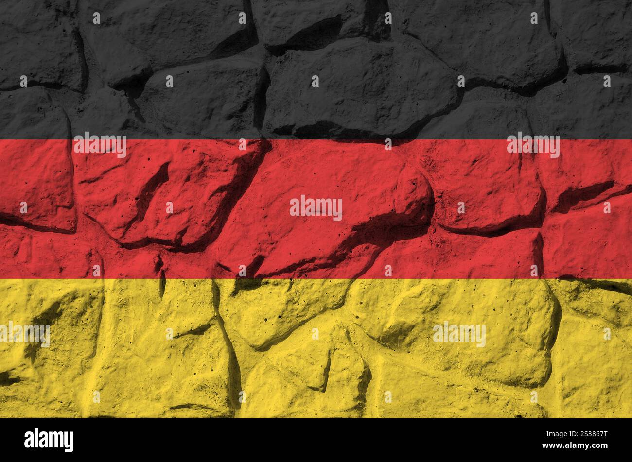 Germany flag depicted in paint colors on old stone wall close up ...