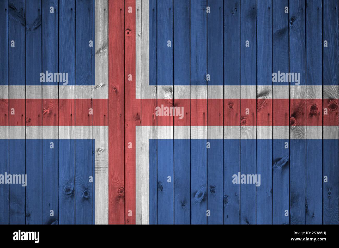 Iceland flag depicted in bright paint colors on old wooden wall close ...