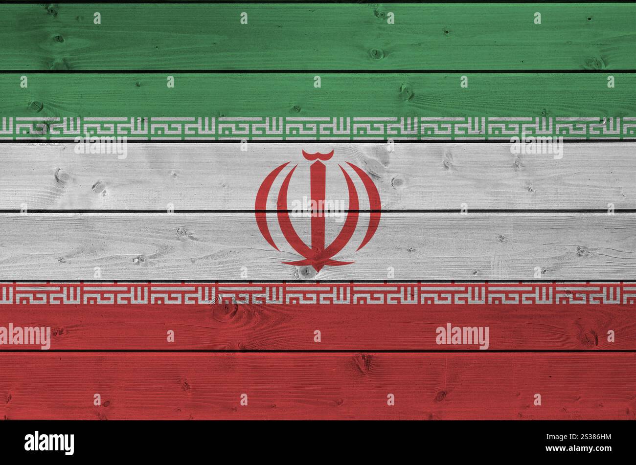 Iran flag depicted in bright paint colors on old wooden wall close up ...
