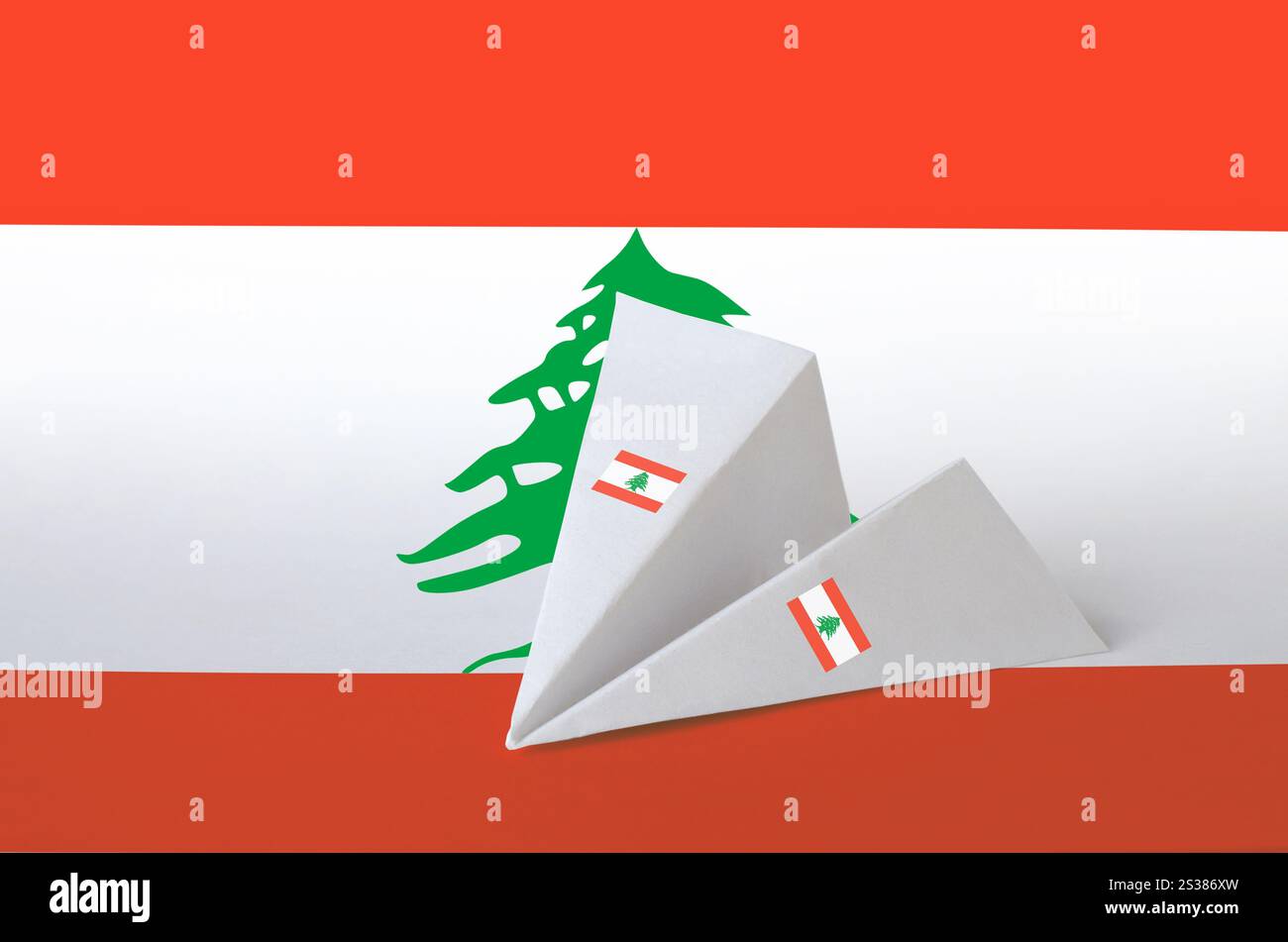 Lebanon flag depicted on paper origami airplane. Oriental handmade arts ...