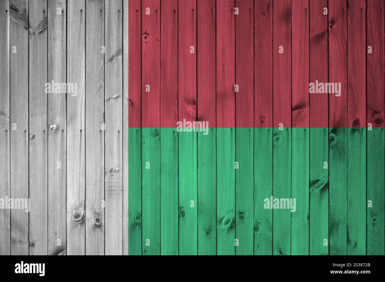 Madagascar flag depicted in bright paint colors on old wooden wall ...