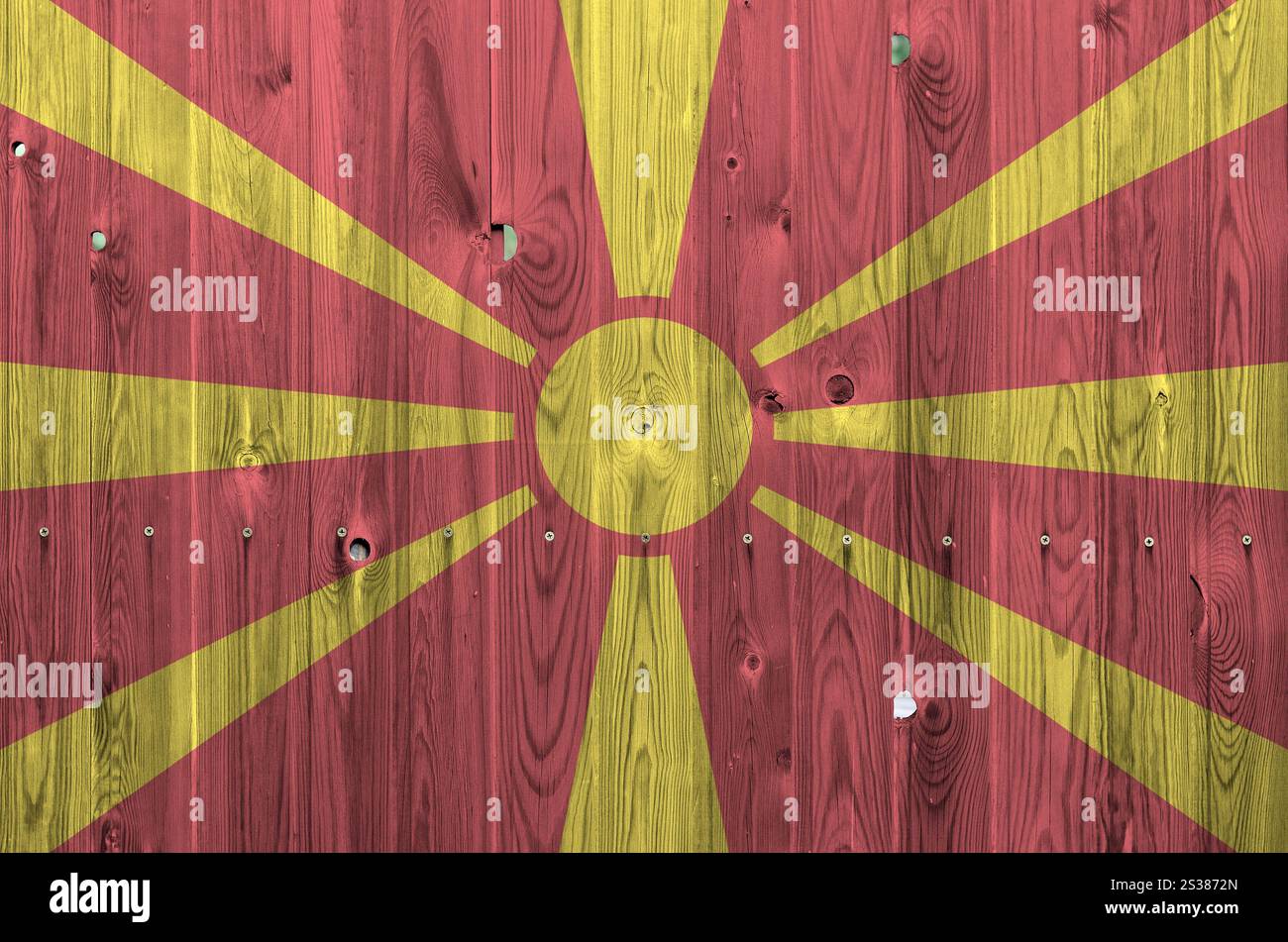 Macedonia flag depicted in bright paint colors on old wooden wall close ...