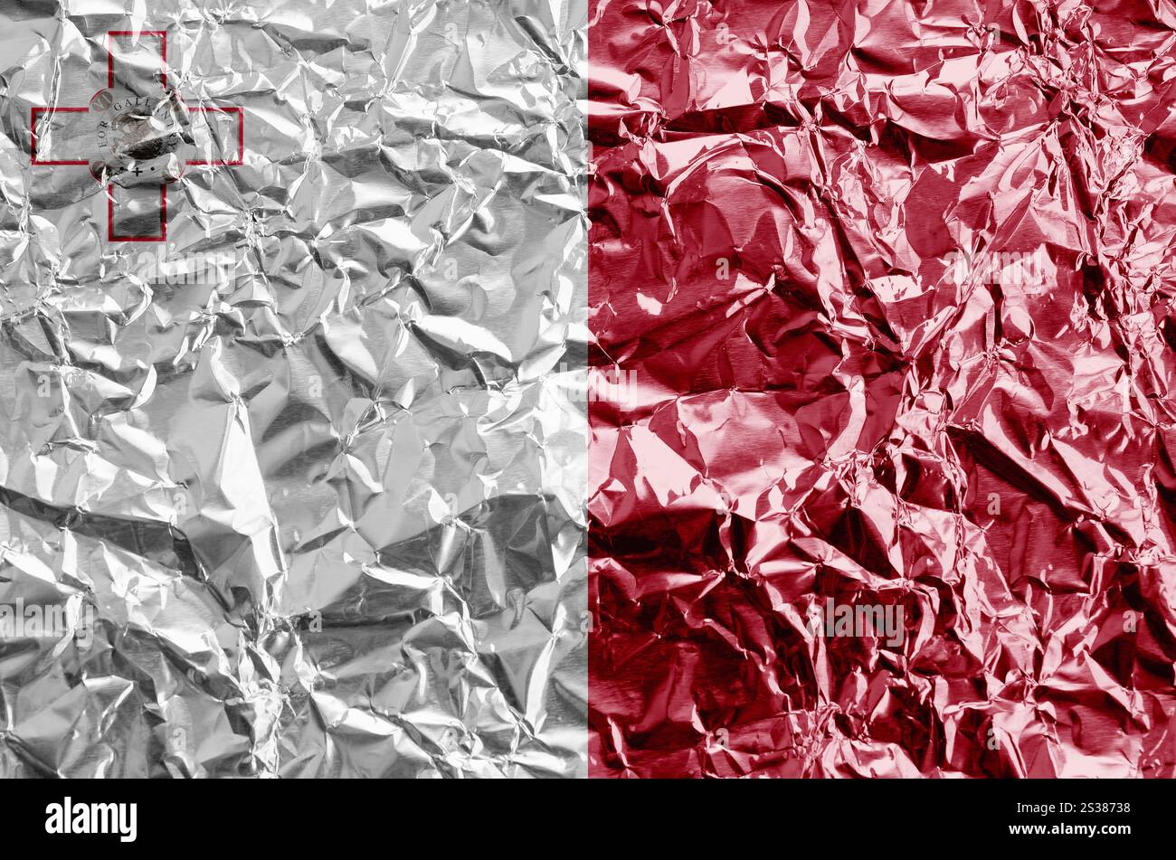 Malta flag depicted in paint colors on shiny crumpled aluminium foil ...