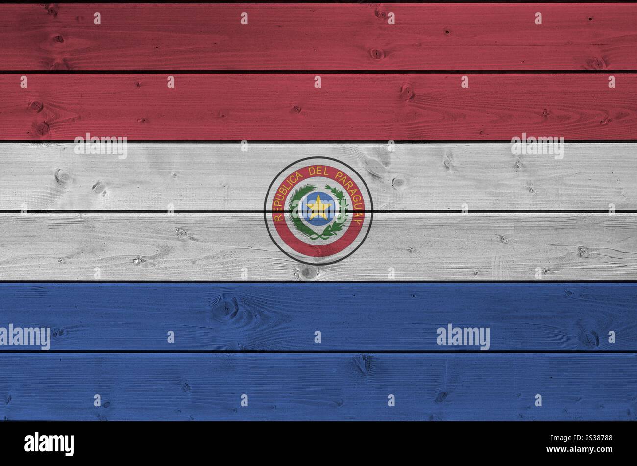 Paraguay flag depicted in bright paint colors on old wooden wall close ...